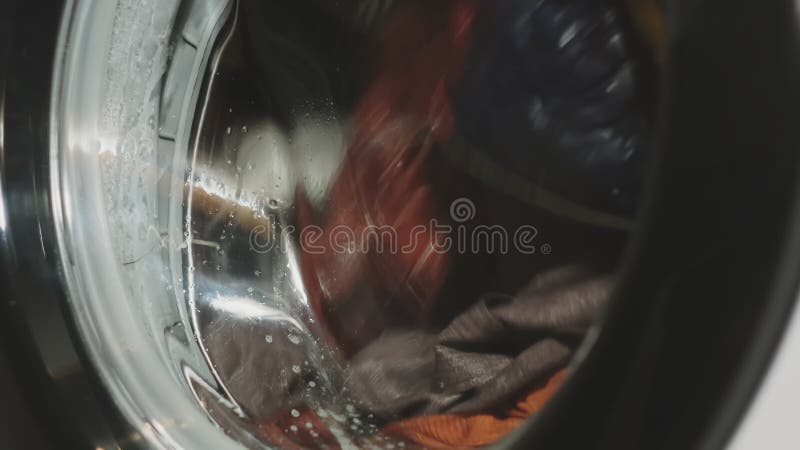 Dirty Laundry Spinning Inside Washing Machine Drum. Laundry Service ...