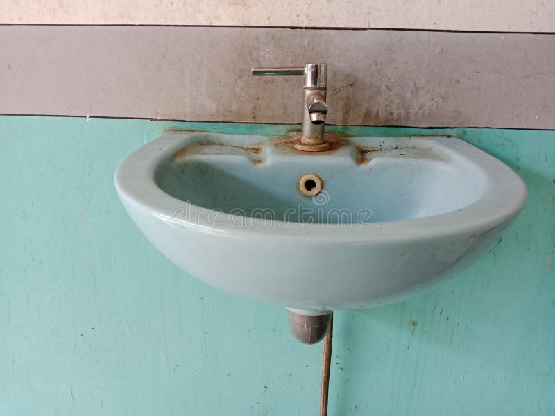 A Dirty Light Blue Sink Full of Dust and Scale Stock Image - Image of ...