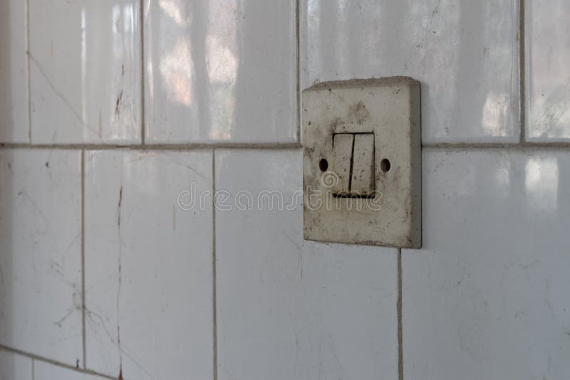 Dirty Light Switch on Tiled Wall Close Up Stock Image - Image of urban ...