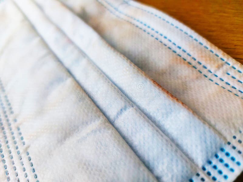 Dirty Mask with Makeup Stain on Table Stock Photo - Image of mask ...