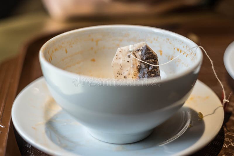A Dirty Mug with a Used Tea Bag. Stock Photo - Image of cafe, coffee ...