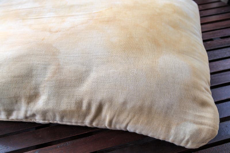 Dirty Pillow on Wooden Table. Stock Image - Image of cloth, damage ...