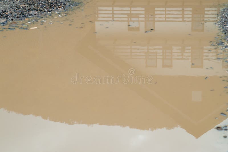 Dirty Puddle. Reflection in a Muddy Puddle Stock Photo - Image of ...