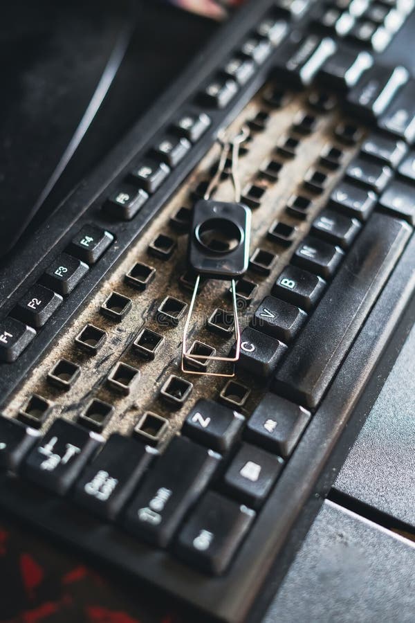 Dirty Qwerty Keyboard Full of Dusts and Debris on the Table. Cleaning ...