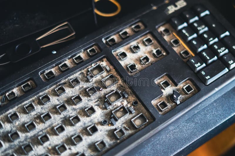 Dirty Qwerty Keyboard Full of Dusts and Debris on the Table. Cleaning ...