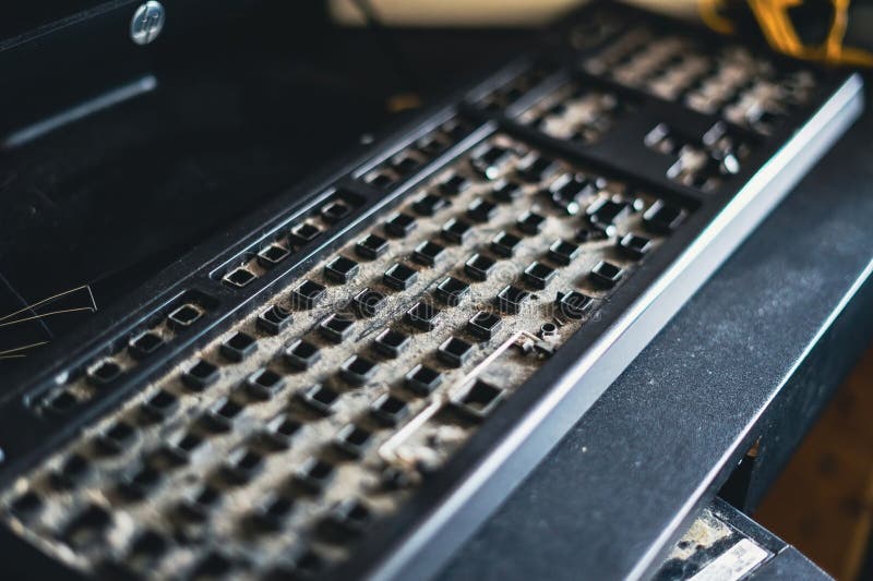 Dirty Qwerty Keyboard Full of Dusts and Debris on the Table. Cleaning ...