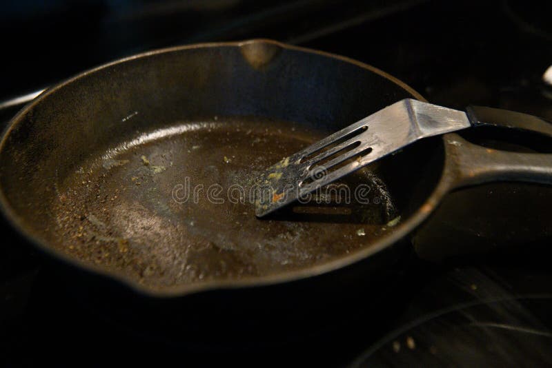 Dirty Skillet with Metal Spatula Stock Image - Image of cast, handle ...