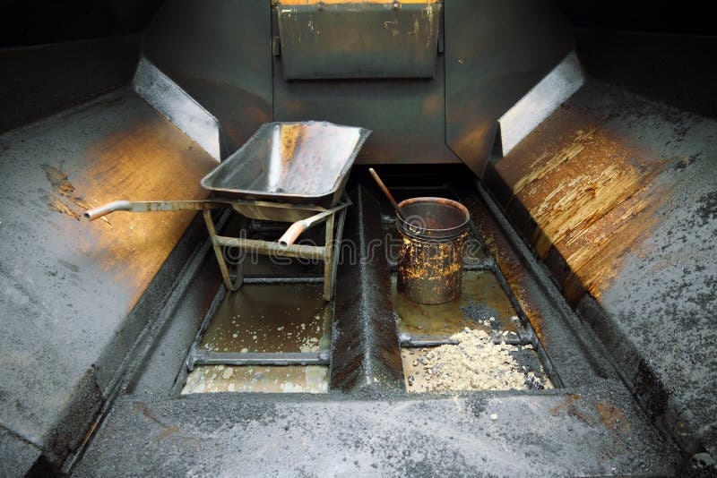 Dirty Tar Bucket and Wheelbarrow Stock Photo - Image of black, road ...