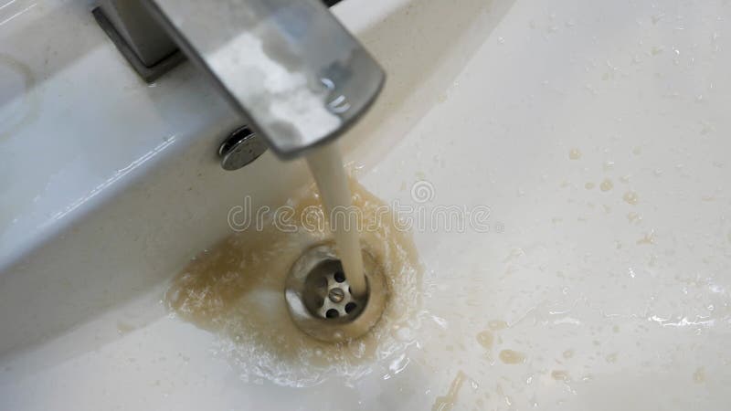 Dirty Water from Sink Reveals Plumbing Issue with Clean Water Stock ...