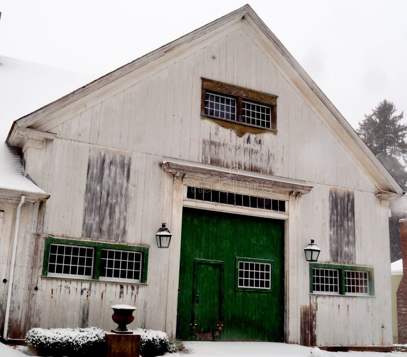 Dirty White Multi-storied Barn with Green Barn Door and Multi-paned ...