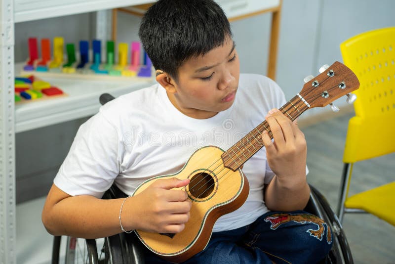 Disability Kid on Wheelchair with Musical Instrument Guitar Child in ...