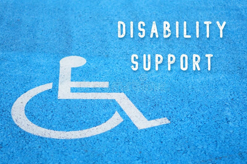 Disability Support. Message Written on the Asphalt Next To a Sign with ...
