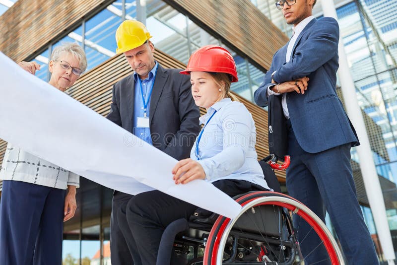 Disabled Architect in a Wheelchair and Engineers Stock Photo - Image of ...