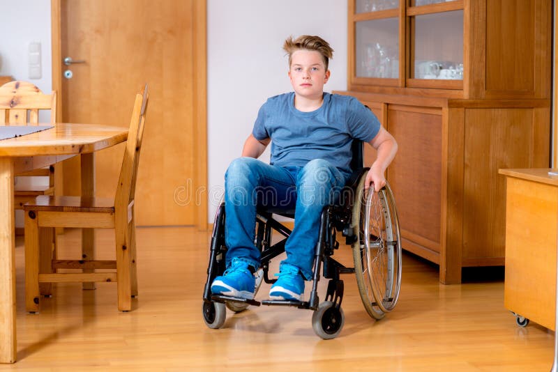 Disabled Boy in Wheelchair at Home Stock Image - Image of livingroom ...