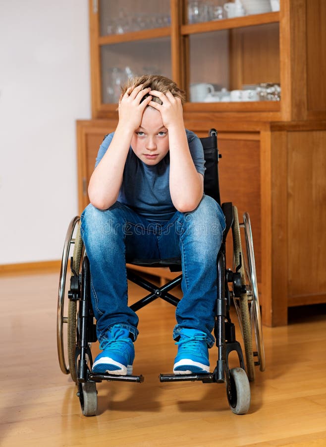 Sad Child In Wheelchair