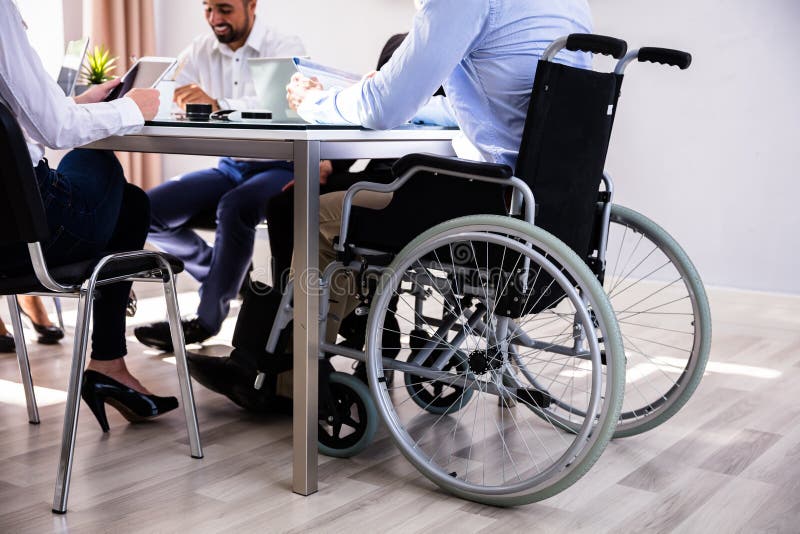 Disabled Businessman Sitting in Office Stock Photo - Image of ...