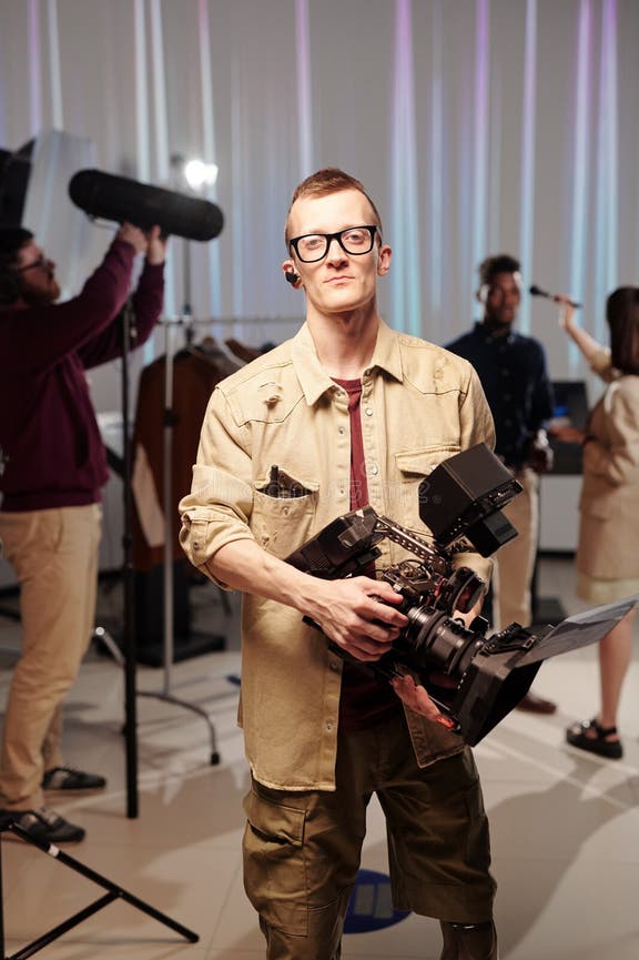 Disabled Cameraman Standing Against Shooting Group Stock Photo - Image ...