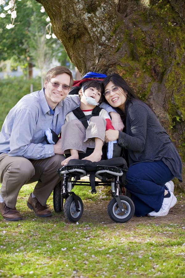 Disabled Child Surrounded by Parents Stock Photo - Image of healthy ...