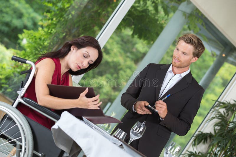 Disabled Customer Giving Male Waiter Restaurant Order Stock Photo ...
