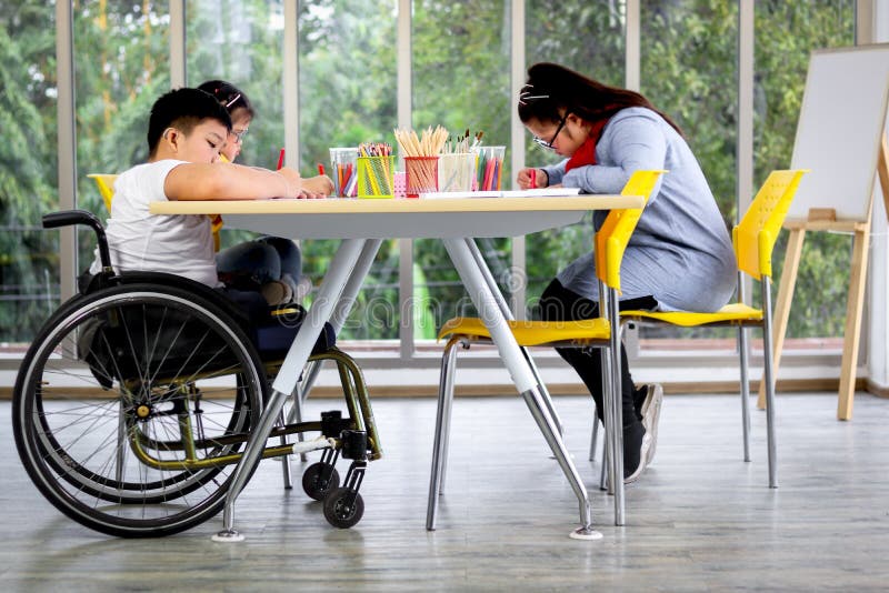 Disabled Kids Classroom, School Boy on Wheelchair with Teacher, Child ...