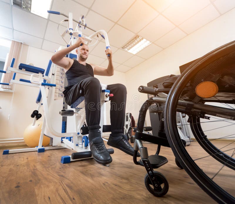 Disabled Man Doing Strength Exercises Separate from the Wheelchair ...