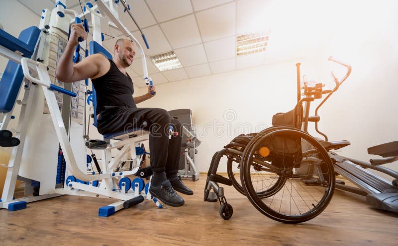 Disabled Man Doing Strength Exercises Separate from the Wheelchair ...
