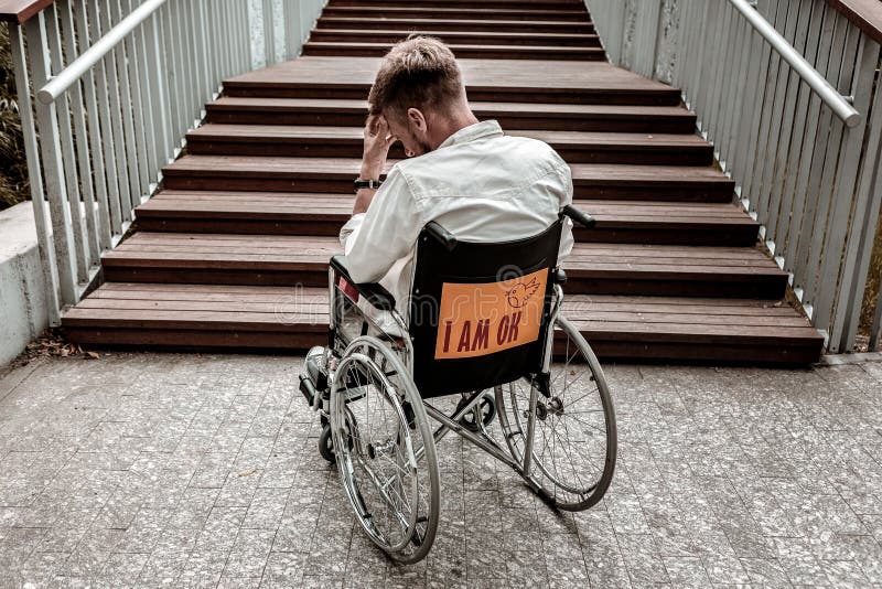 Disabled Man Facing Big Barrier and Looking Hopeless Stock Photo ...