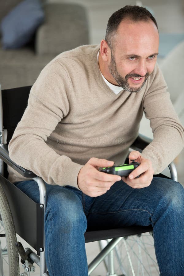 Disabled Man Playing Computer Games during Rehabilitation Stock Photo ...