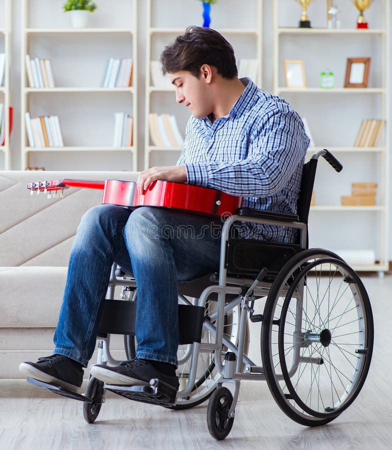 Disabled Man Playing Guitar at Home Stock Image - Image of book ...