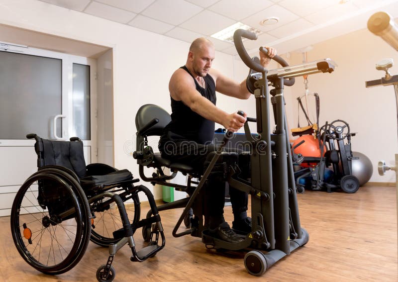 Disabled Man Training in the Gym. Rehabilitation Center Stock Photo ...