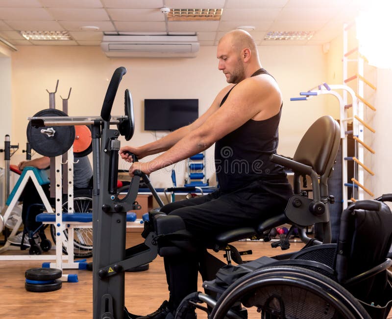 Disabled Man Training in the Gym. Rehabilitation Center Stock Photo ...