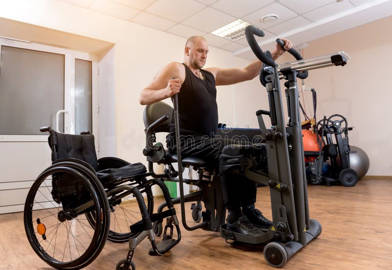 Disabled Man Training in the Gym. Rehabilitation Center Stock Photo ...