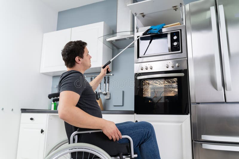Disabled Man Using Grabber Tool in Kitchen Stock Image - Image of ...