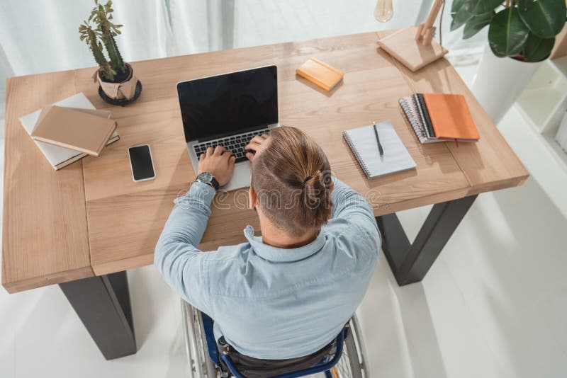 Disabled man using laptop stock photo. Image of care - 104992778
