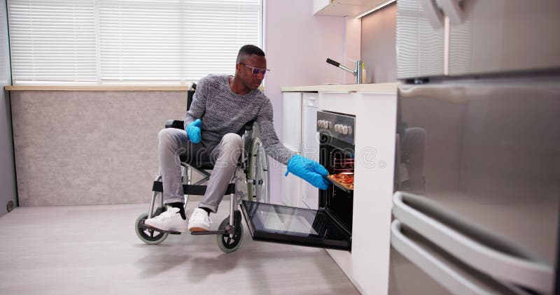 Disabled Man Using Microwave Oven for Baking Stock Image - Image of ...