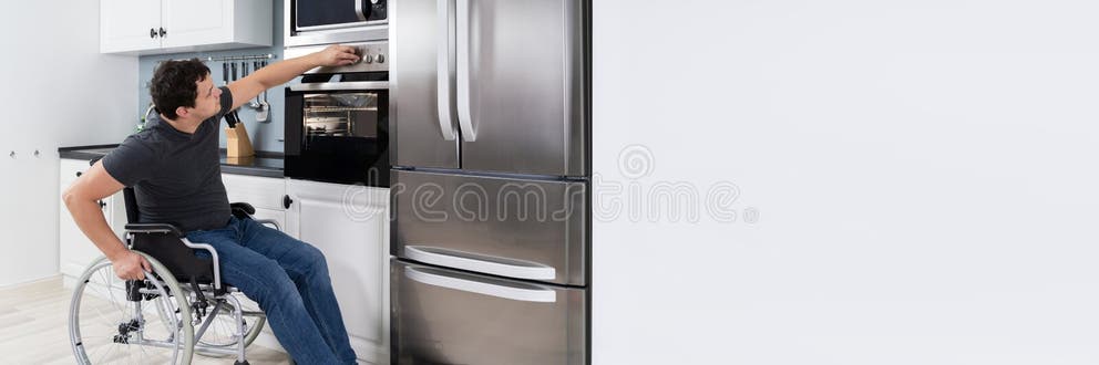 Disabled Man Using Microwave Oven in Kitchen Stock Photo - Image of ...