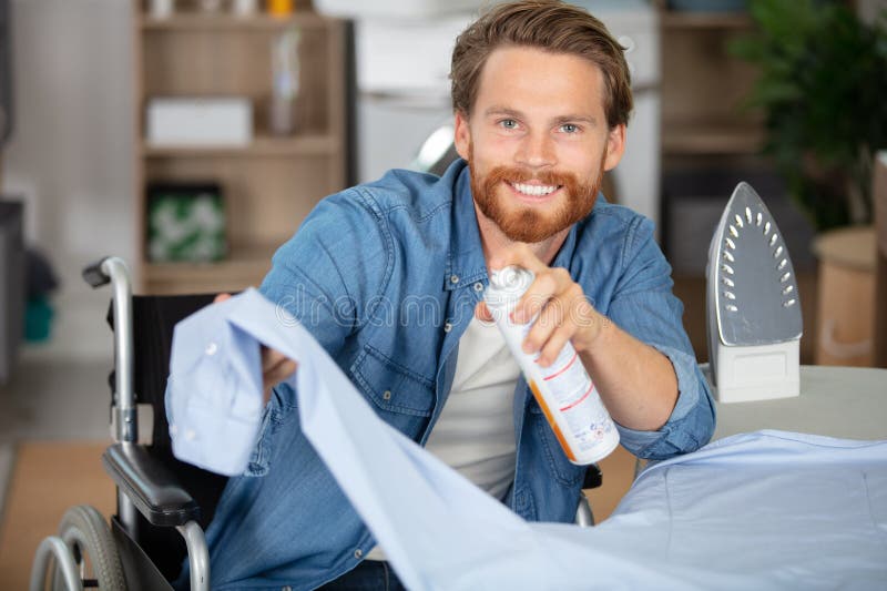 Disabled Man Using Spray on Shirthe Ironing Stock Photo - Image of ...