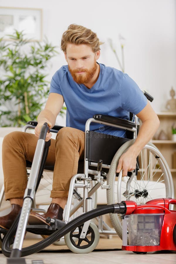 Man using a vacuum cleaner stock photo. Image of people - 22365900