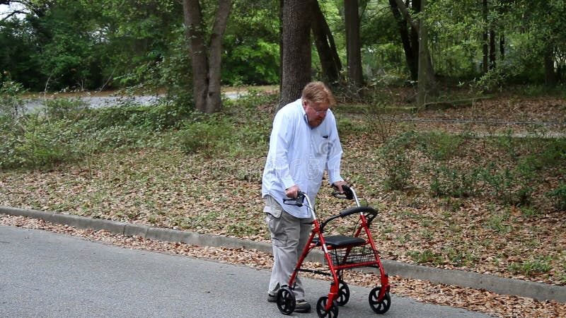 Disabled Man Using Walker stock footage. Video of mobility - 55051942