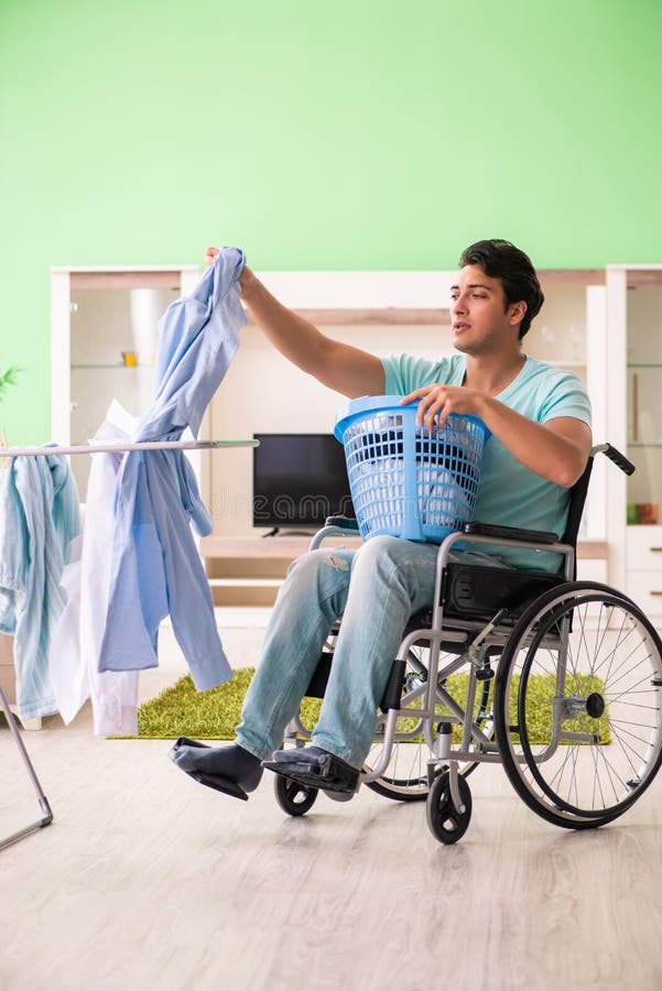 The Disabled Man on Wheelchair Doing Laundry Stock Image - Image of ...
