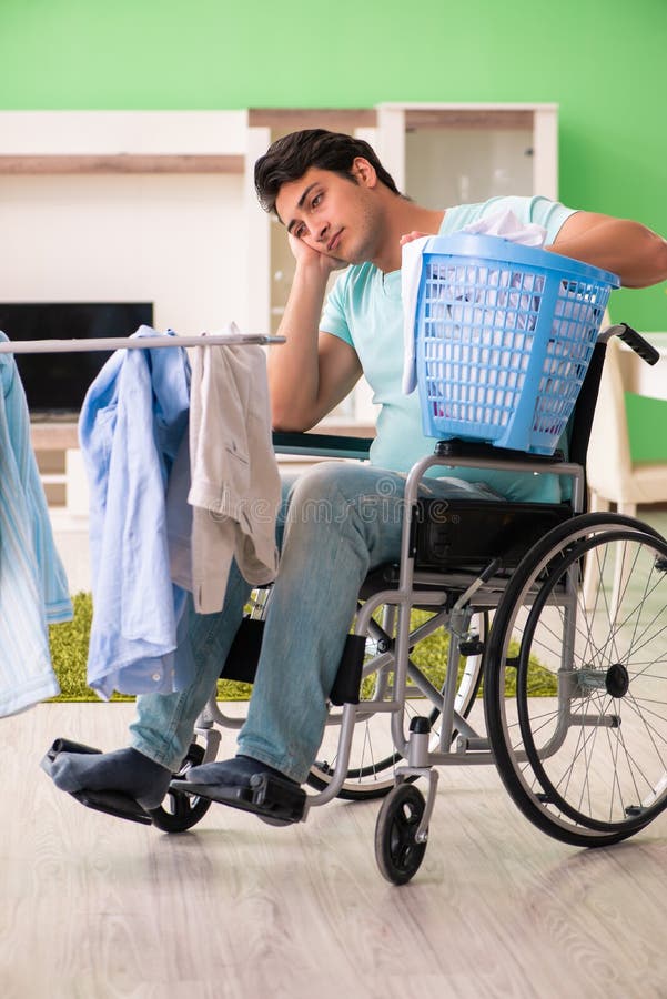The Disabled Man on Wheelchair Doing Laundry Stock Image - Image of ...