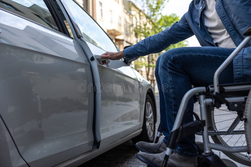 Disabled Man in a Wheelchair Getting in a Car Stock Image - Image of ...