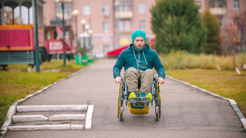 Disabled Man in Wheelchair Going Down the Ramp Outdoors Stock Image ...