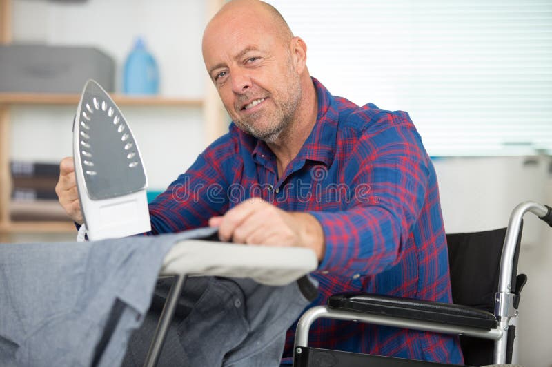 Disabled Man on Wheelchair Ironing Clothing Stock Image - Image of iron ...