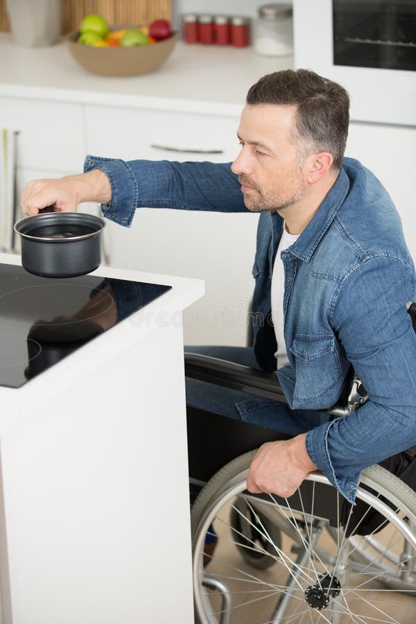 Disabled Man in Wheelchair in Kitchen Stock Photo - Image of cooking ...