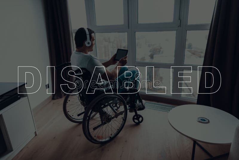 Disabled Man In A Wheelchair Using Tablet Pc Stock Image Image Of