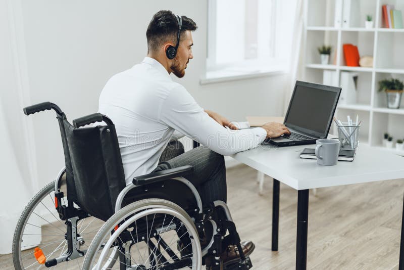 Disabled Man in a Wheelchair Using Laptop Stock Image - Image of ...