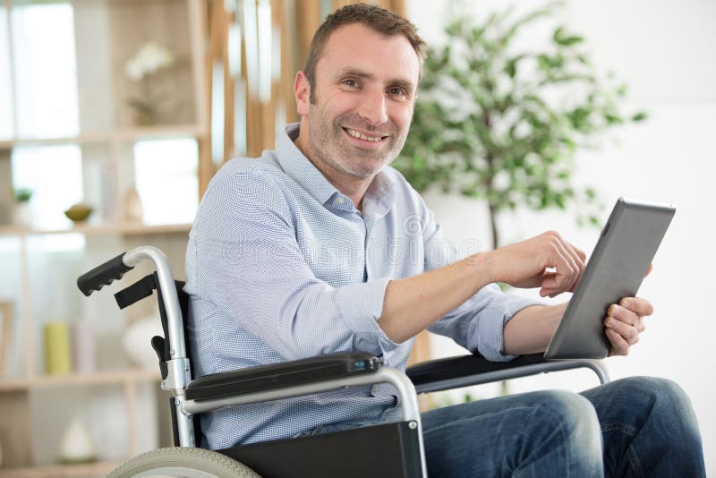 Disabled Man in Wheelchair Using Tablet Pc Stock Photo - Image of ...