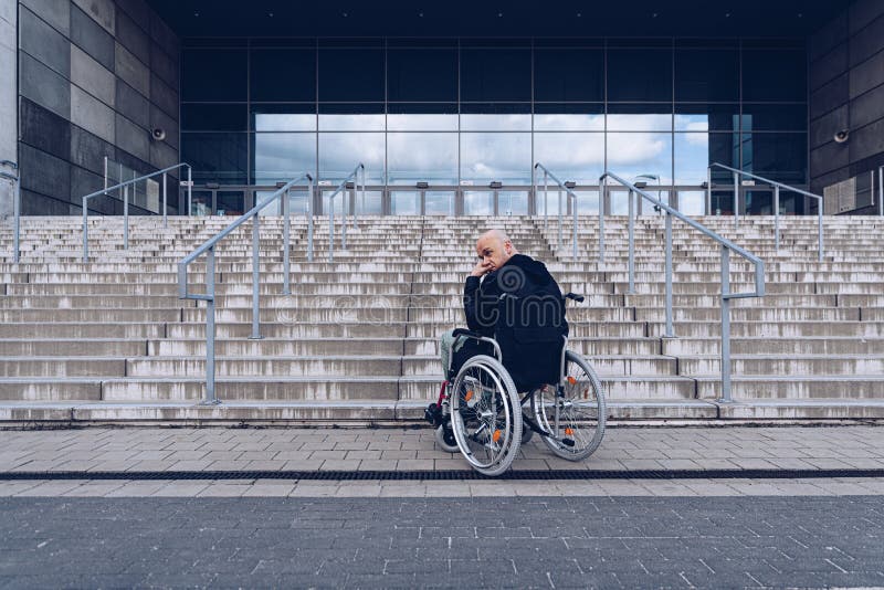 Disabled Man in a Wheelchair Waiting at the Bottom of Steps. Stock ...