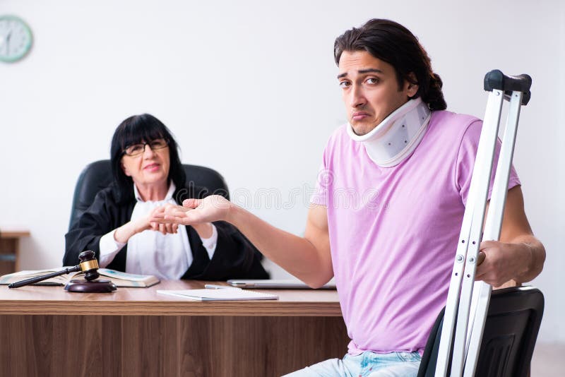 Disabled Man Consulting Judge for Damages Litigation Stock Photo ...
